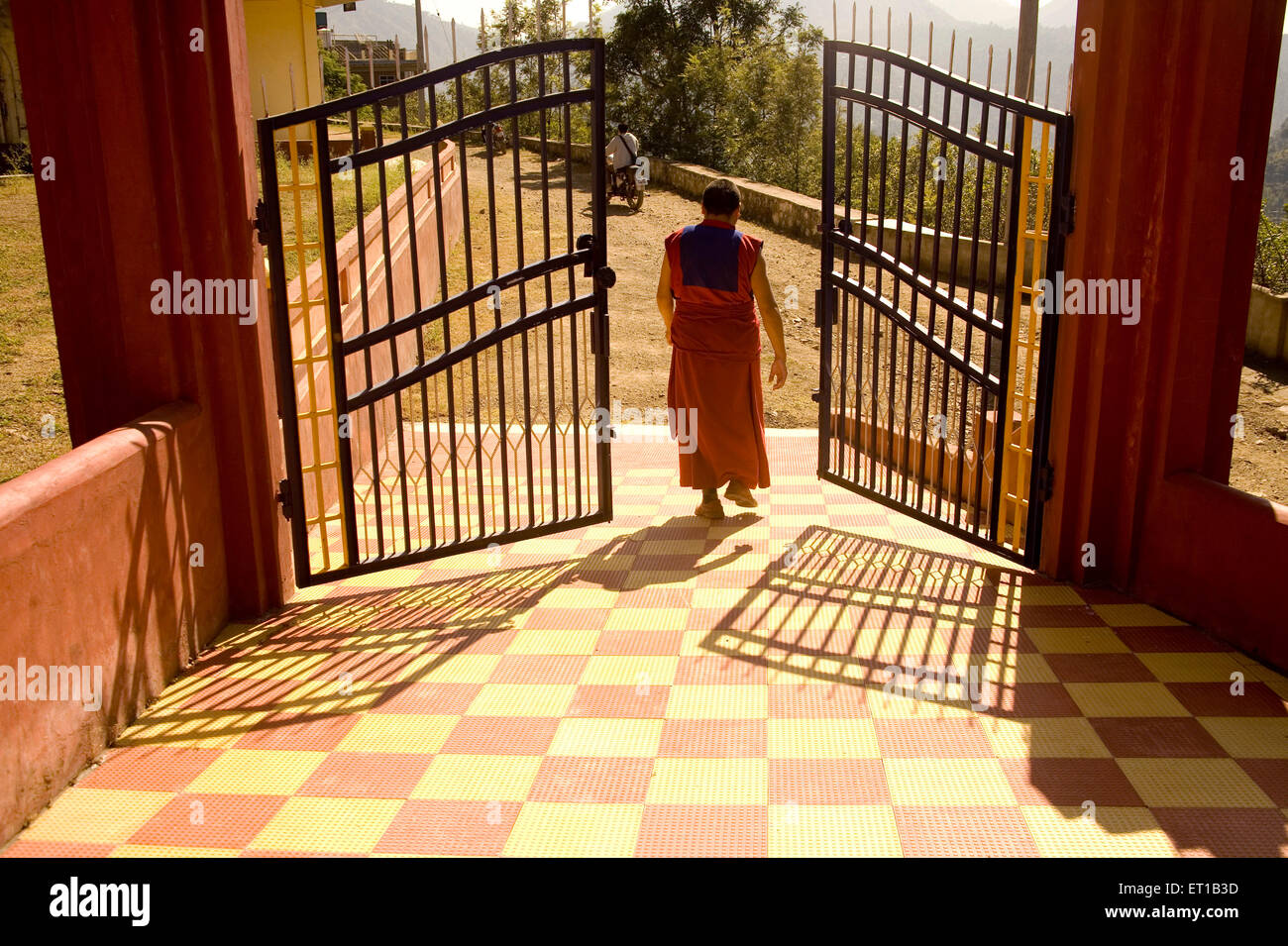 Tibetan monk at gate, McLeod Ganj, McLeodganj, Little Lhasa, Dhasa ...