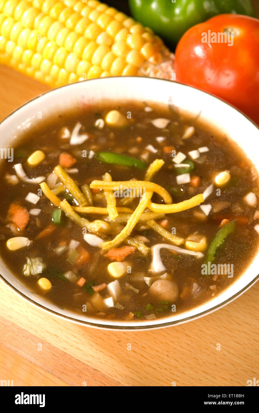 Manchow soup served in bowl Stock Photo - Alamy