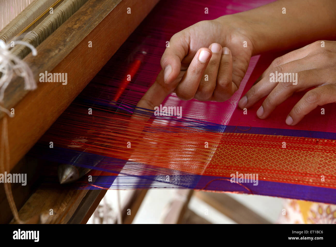 Woman weaving saree sari on handloom Maharashtra India Asia Stock Photo ...