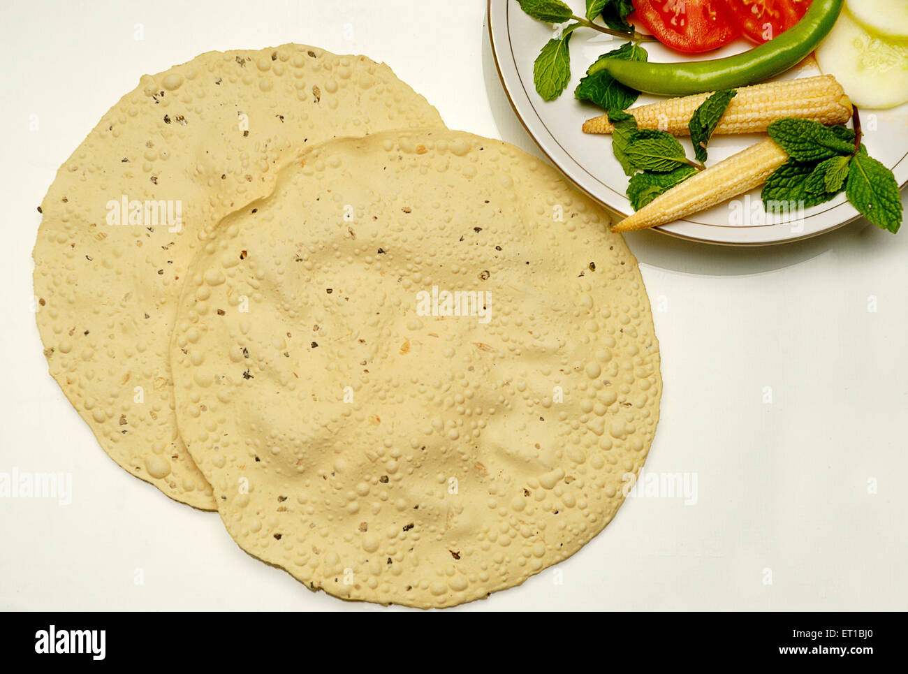 Indian Rajasthani fried snack salty crispy with corn tomato cucumber ...