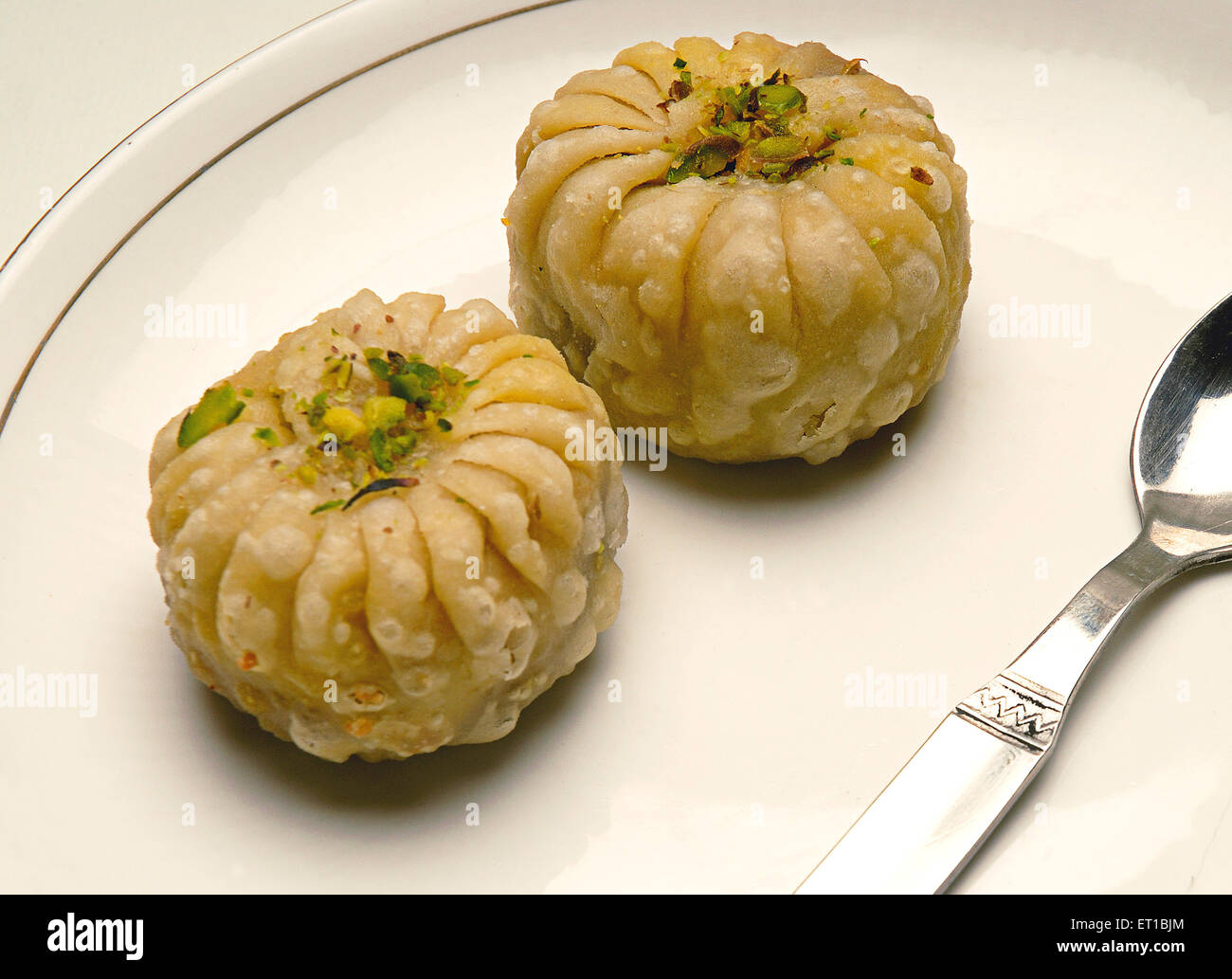 Sweet ; tavapuri served in plate with spoon ; Jodhpur ; Rajasthan ...