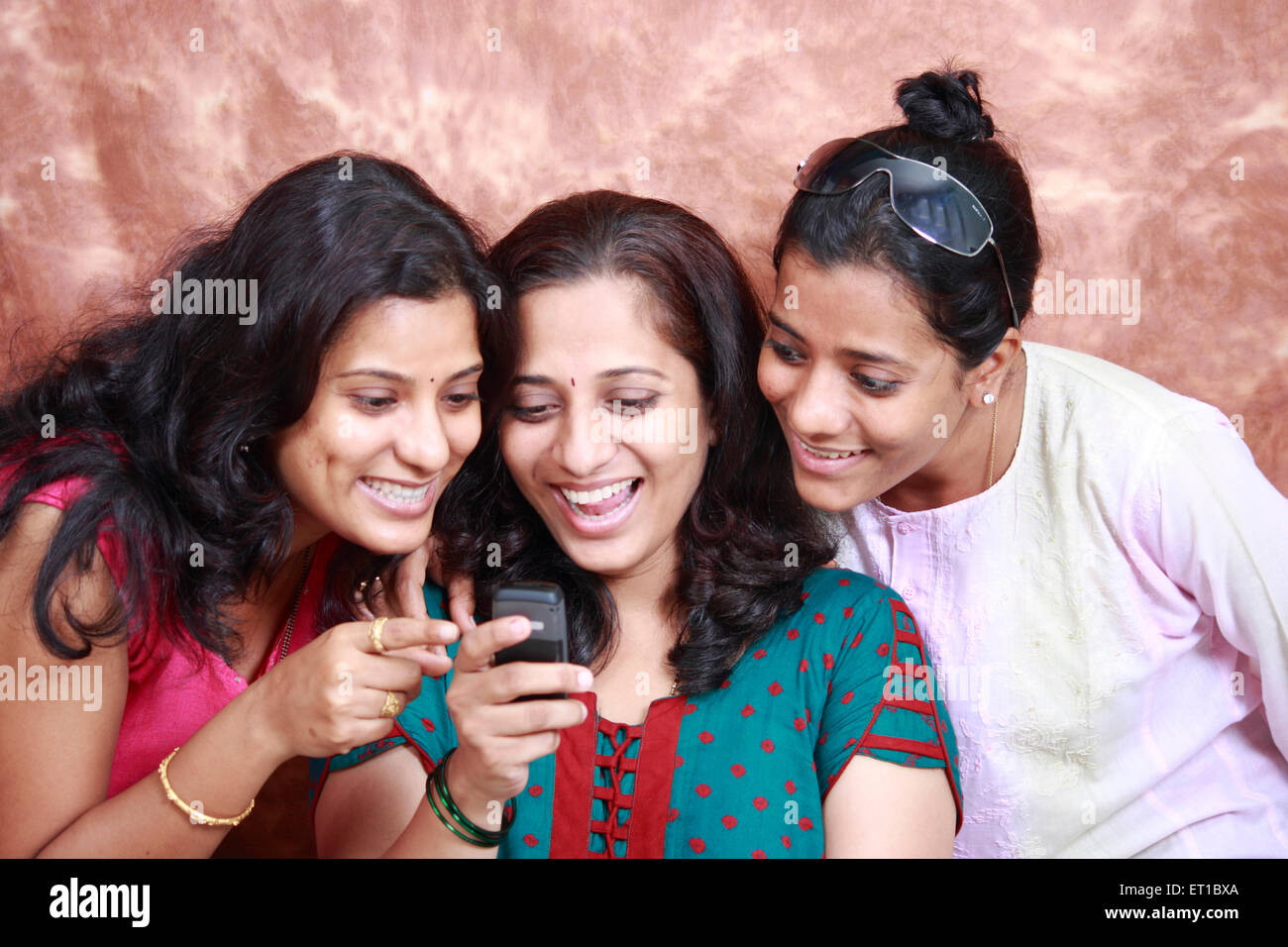 Watching mobile india hi-res stock photography and images - Alamy