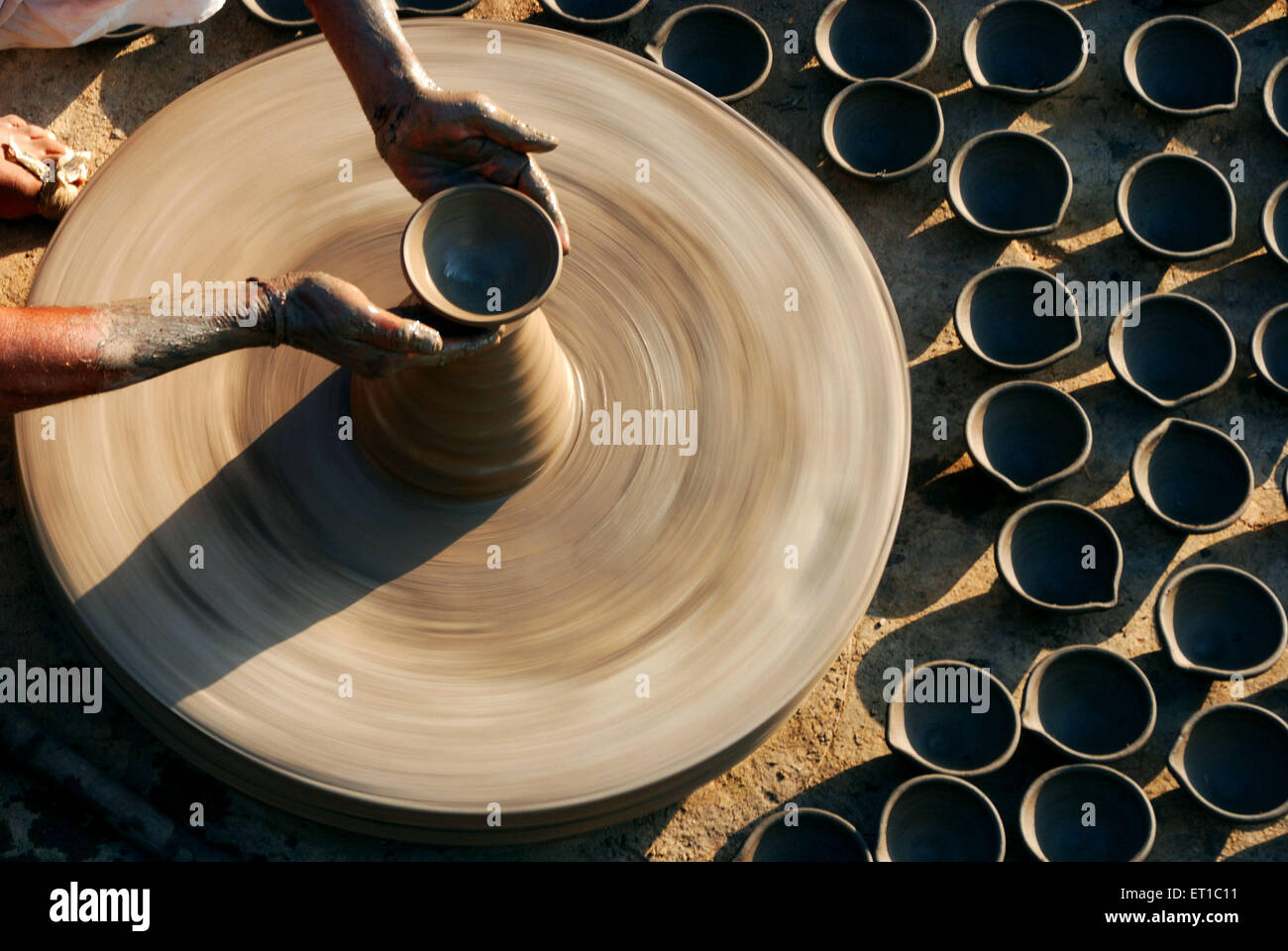 Potter making clay diyas, pottery, clay diya, Diwali festival, Jodhpur ...