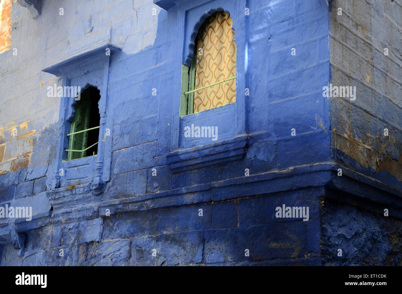 blue house with yellow window in Brahmpuri at Jodhpur Rajasthan India ...