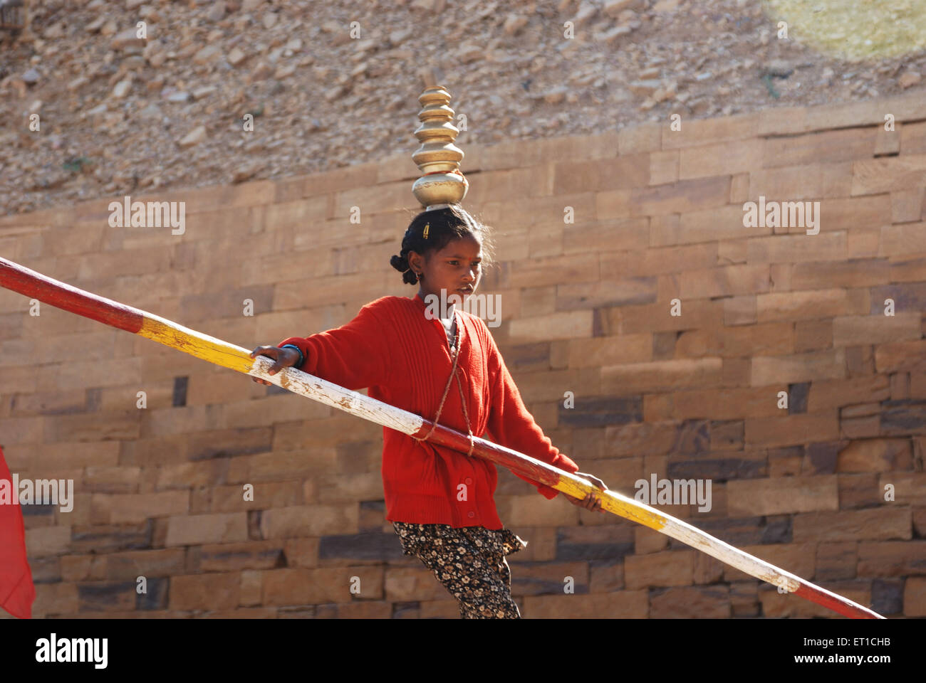 Girl performing acrobat on rope ; Jaisalmer ; Rajasthan ; India NOMR ...