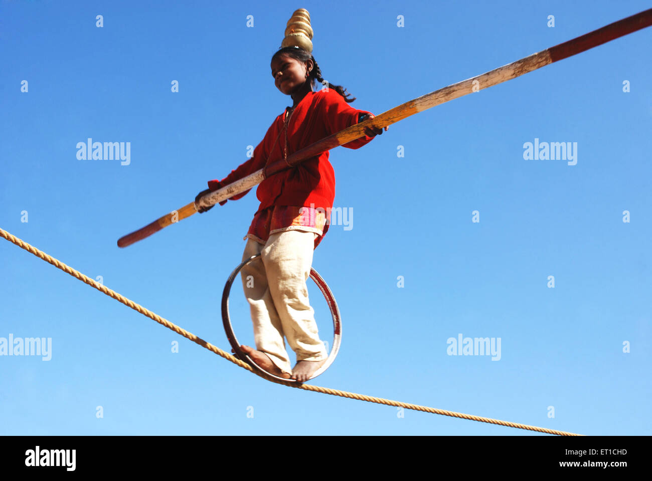 Girl performing acrobat on rope ; Jaisalmer ; Rajasthan ; India NOMR ...