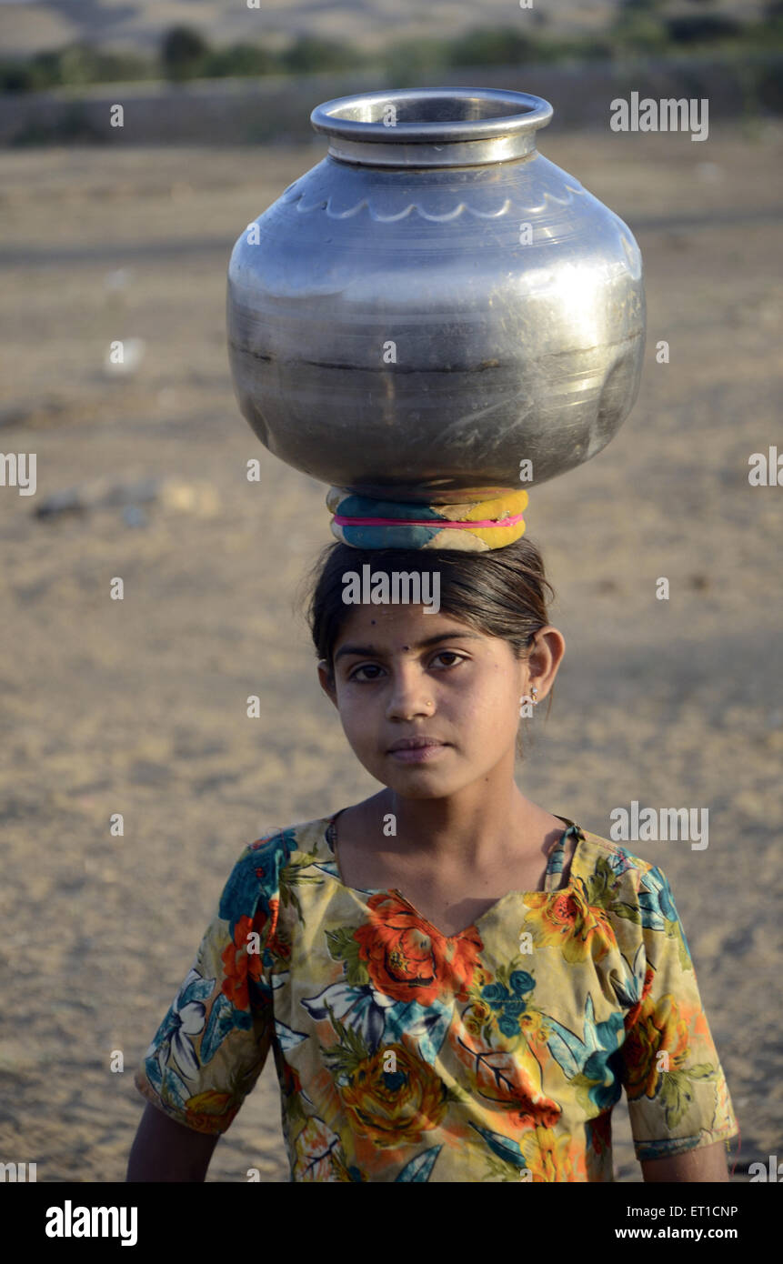young girl carrying water in Jaisalmer at Rajasthan India Stock Photo ...
