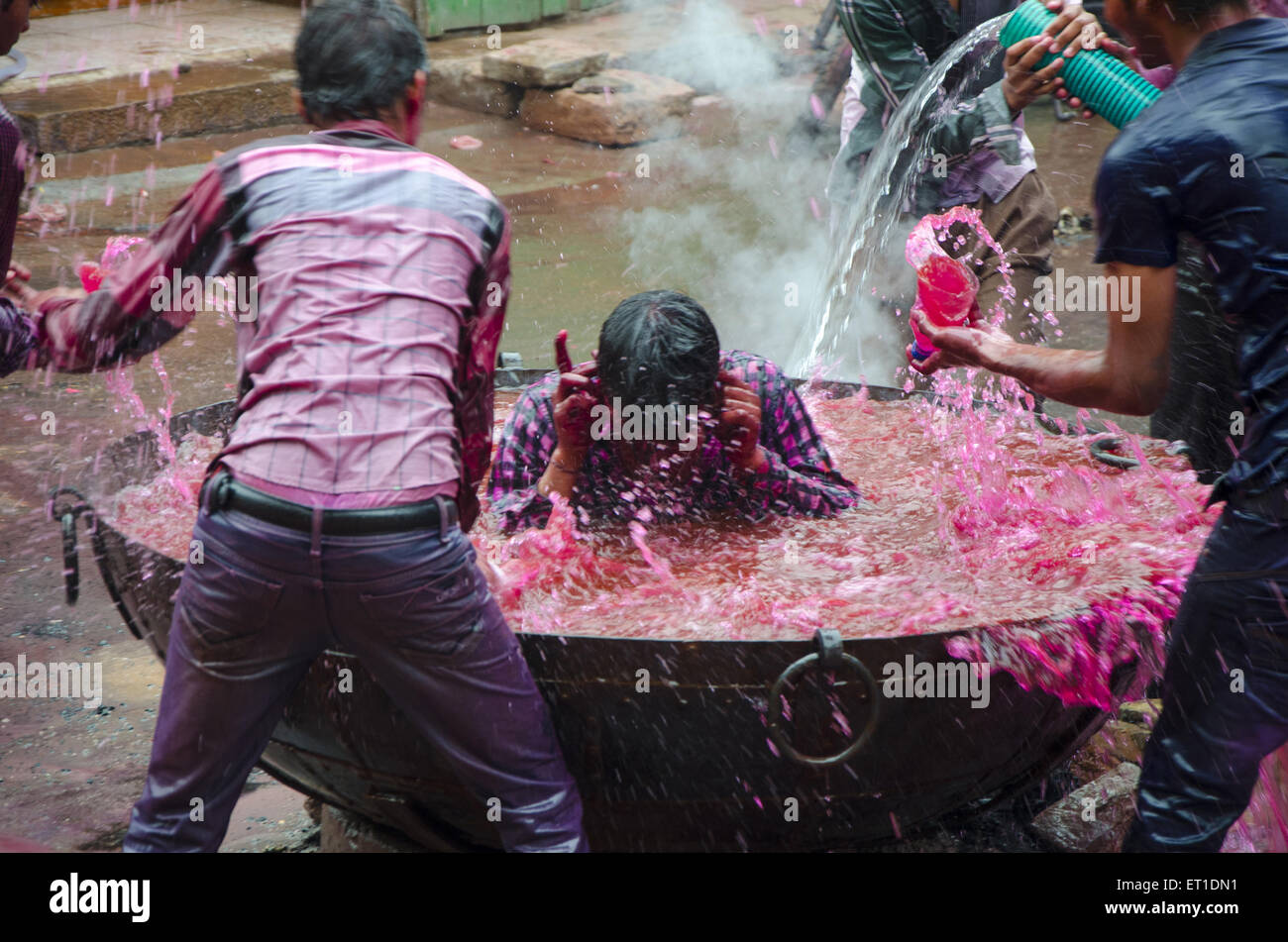 People pouring water with colour in Holi festival Jodhpur at Rajasthan ...