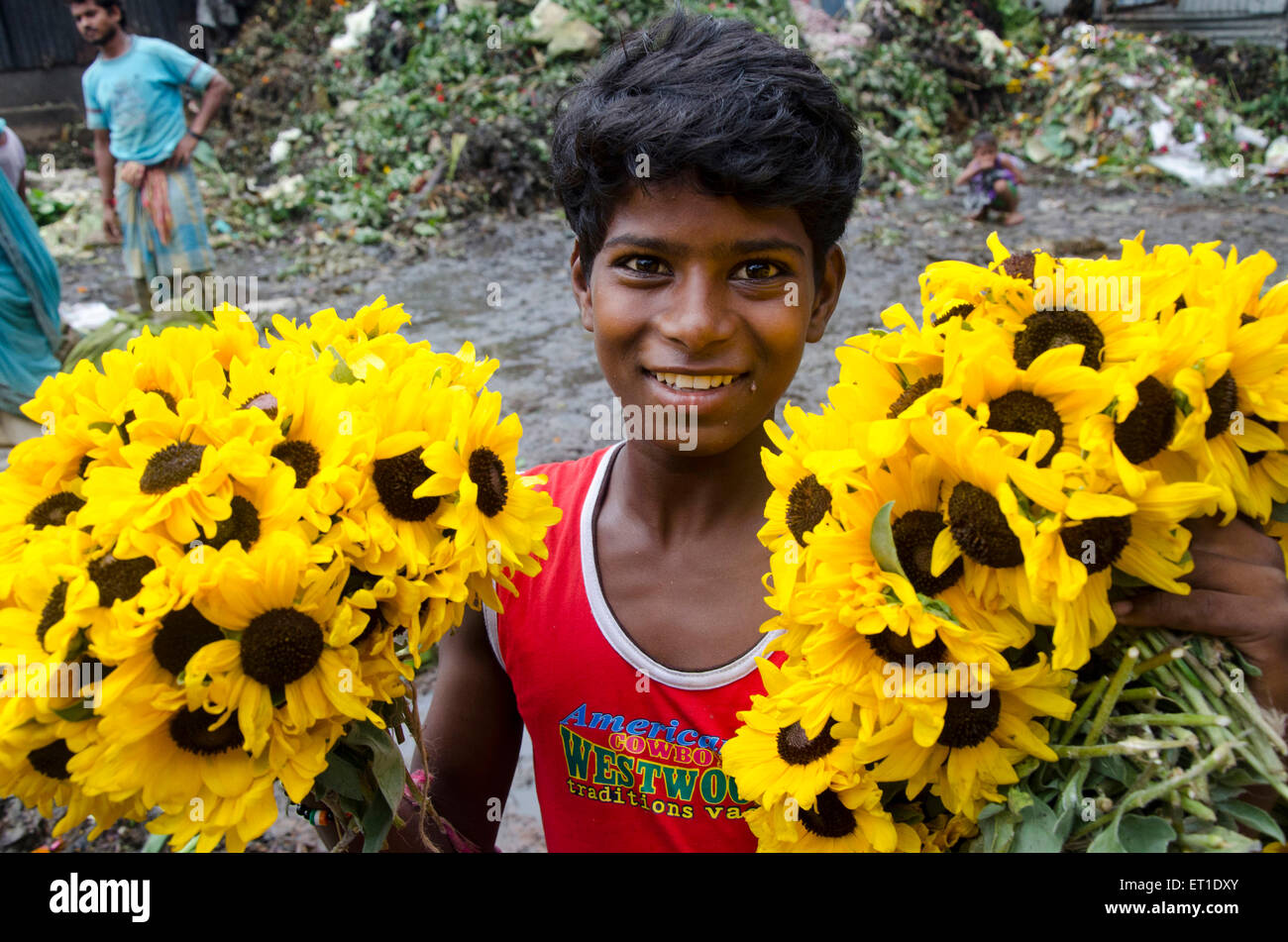 boy selling flowers in market in Kolkata West Bengal India Asia Stock ...