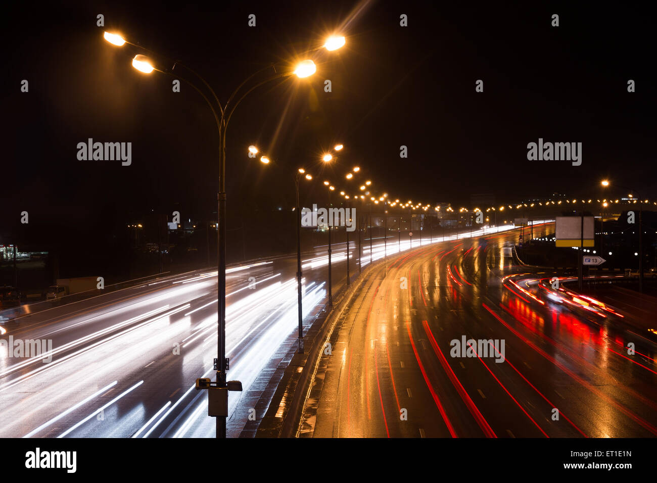 Illuminated highway at night with light trails Stock Photo - Alamy