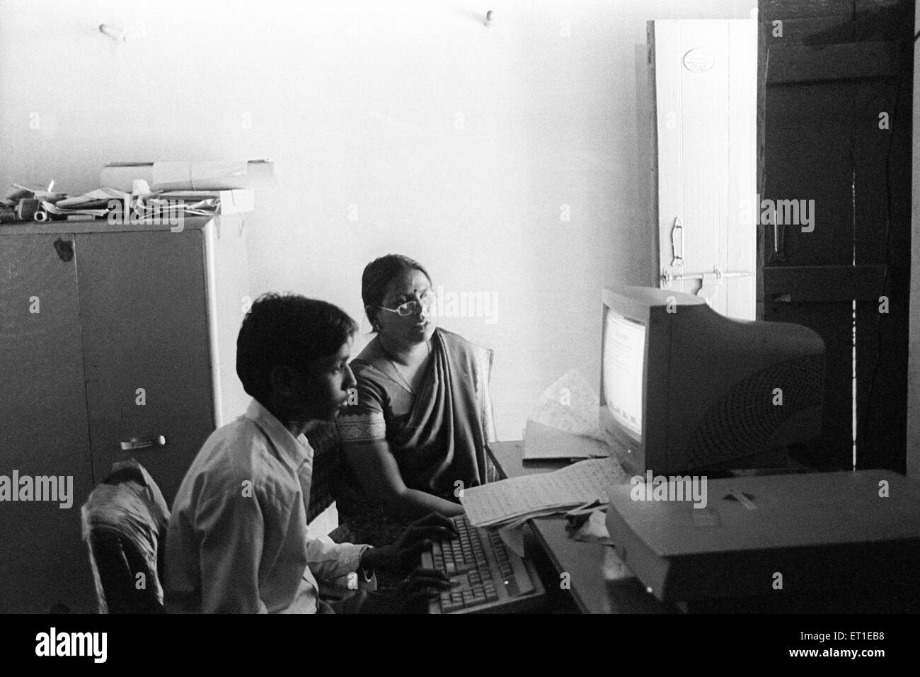 Boy learning computer ; India NO MR Stock Photo - Alamy
