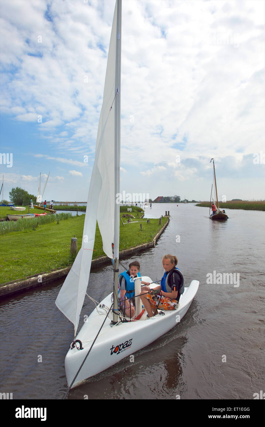 Two girls sailing small boat hi-res stock photography and images - Alamy
