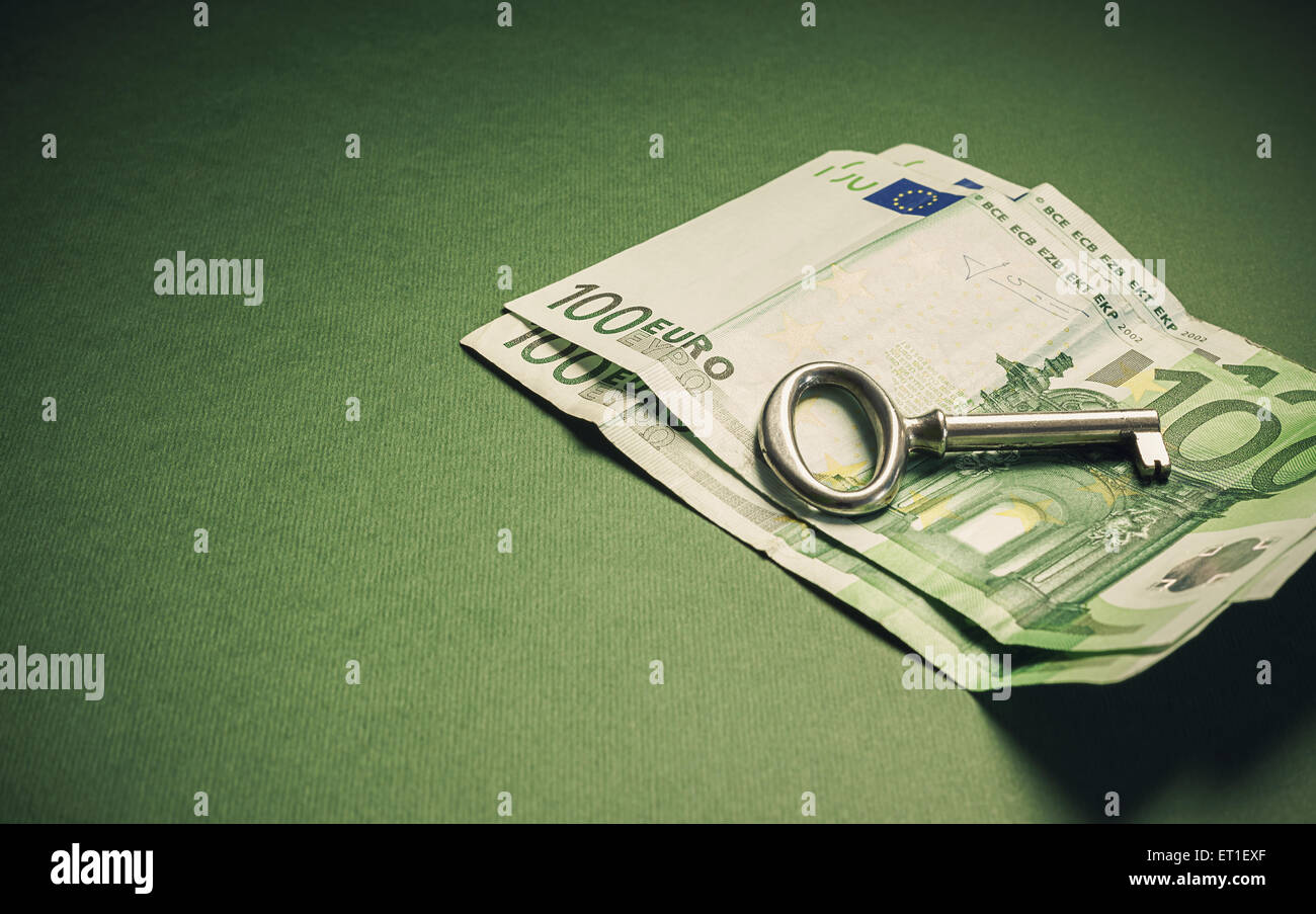 Conceptual composition, euro hundred banknotes with key as symbolic ...