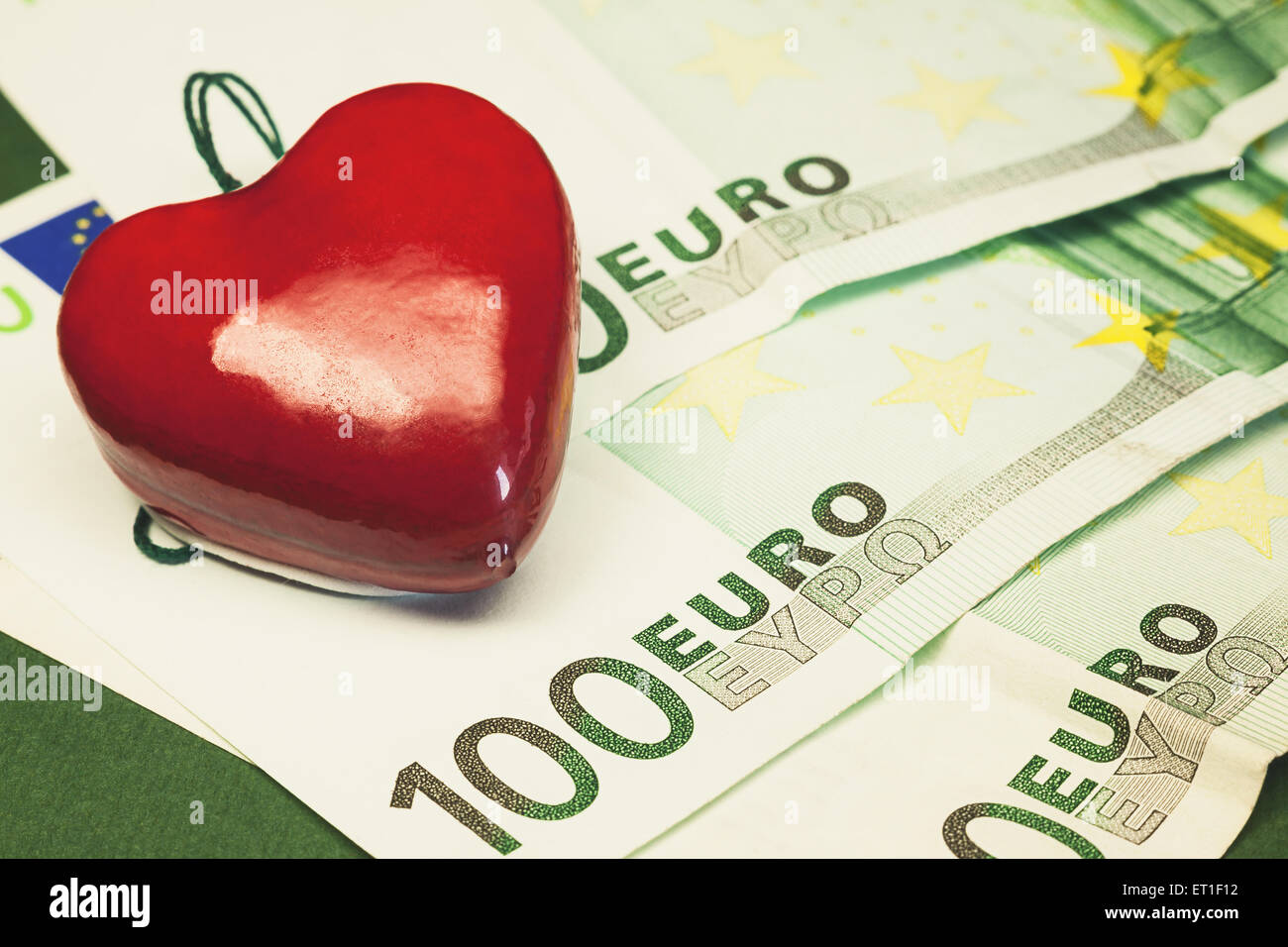 Conceptual composition, euro banknotes and wooden red heart Stock Photo ...