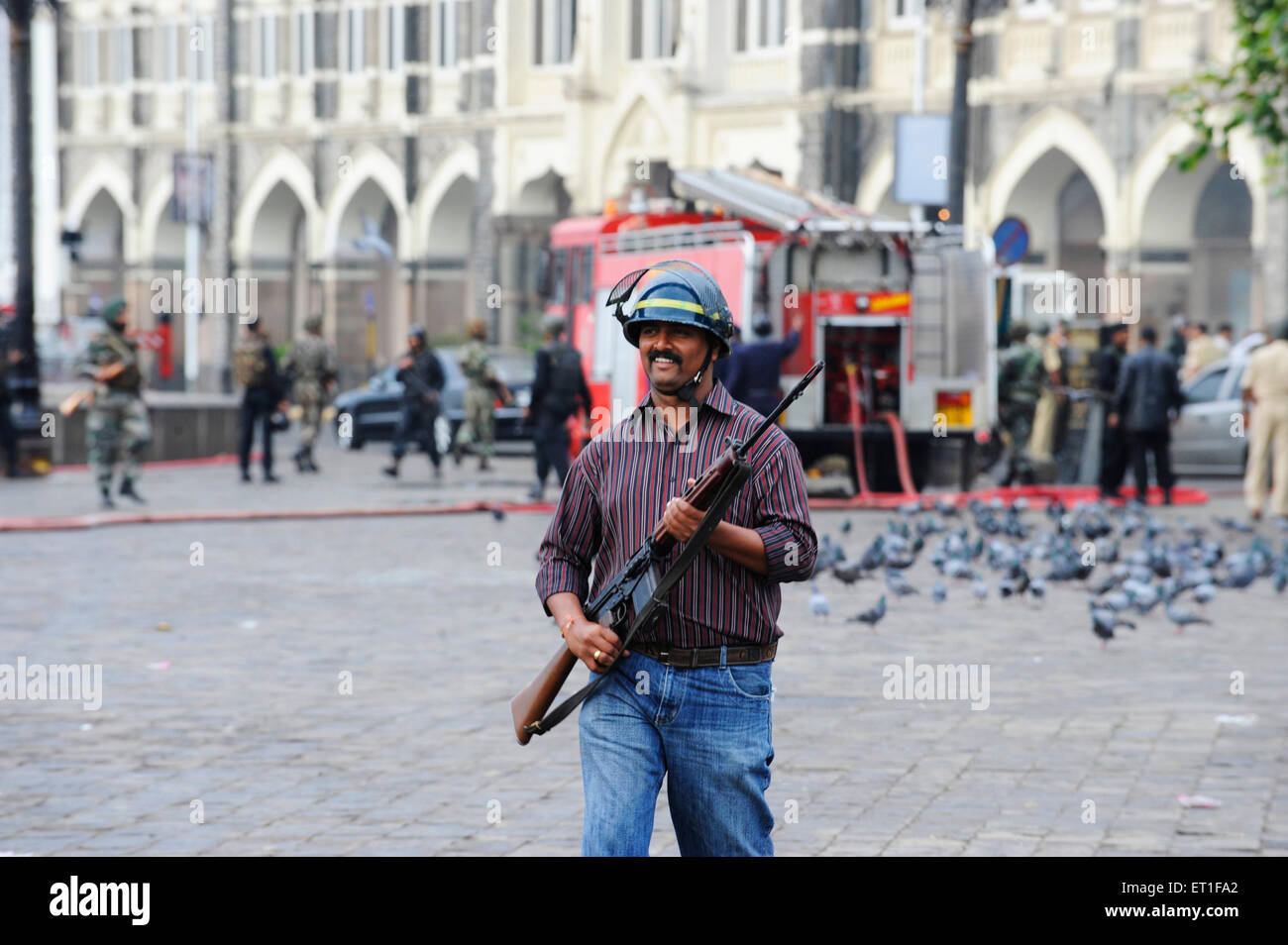 Armed police officer Taj hotel ; Terrorist attack by Deccan Mujahedeen ... Armed police officer Taj hotel ; Terrorist attack by Deccan Mujahedeen ...