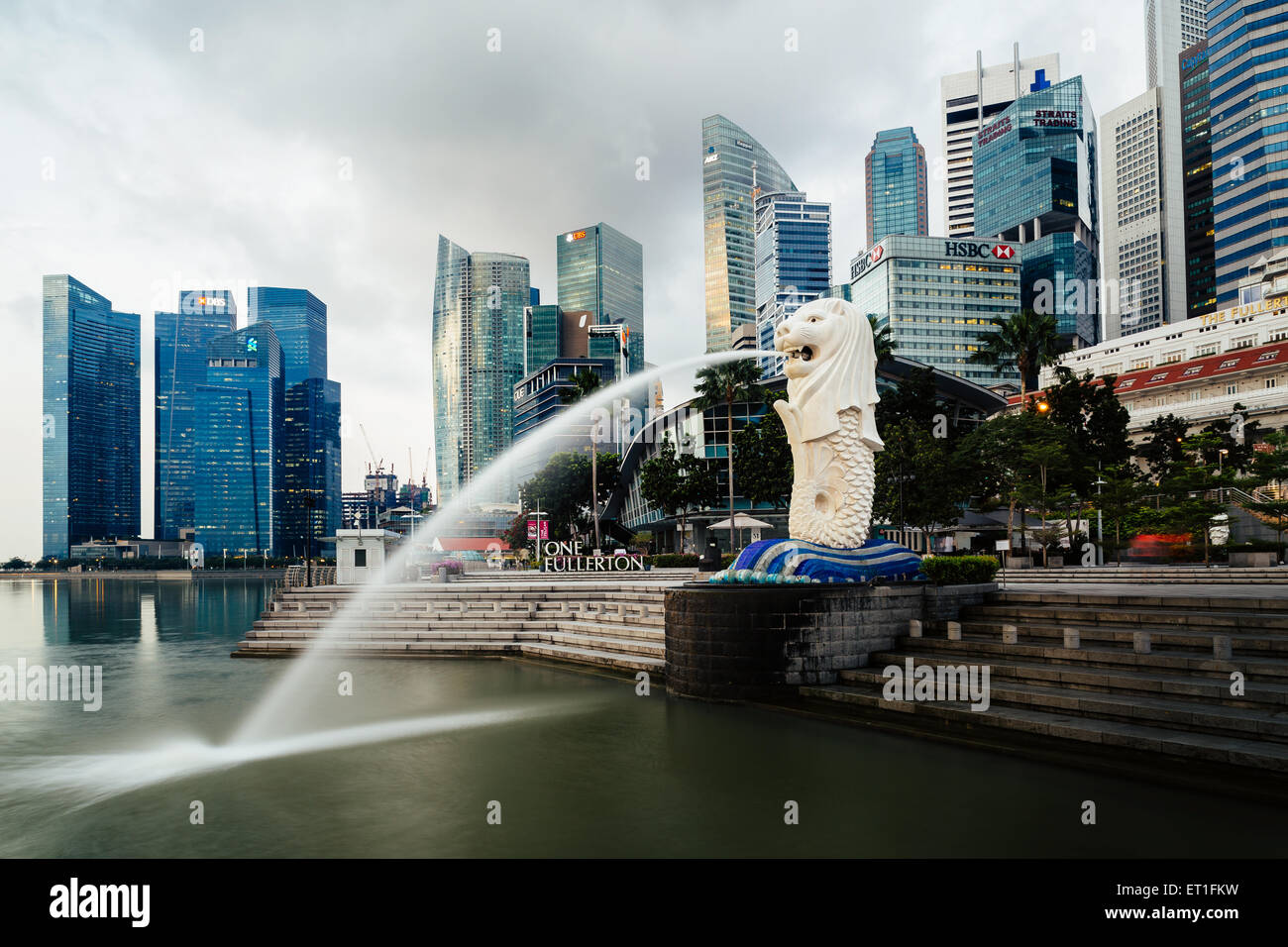 The Merlion fountain and Singapore skyline at morning time. Merlion is ...