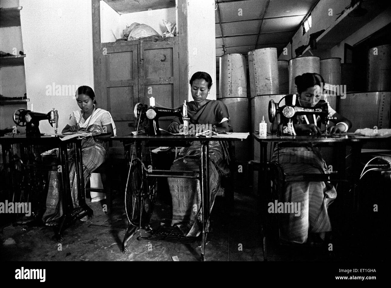 Indian woman sewing machine Black and White Stock Photos & Images - Alamy