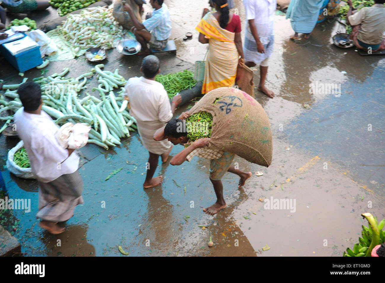 Man carrying jute sack in market ; Thanjavur ; Tamil Nadu ; India Stock ...