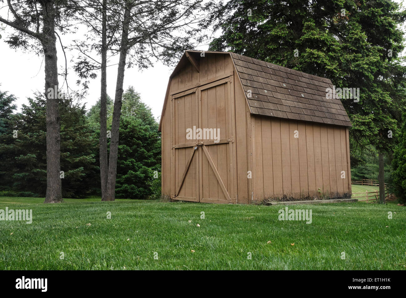 Wooden garden tool shed under trees , hut, United states Stock Photo ...