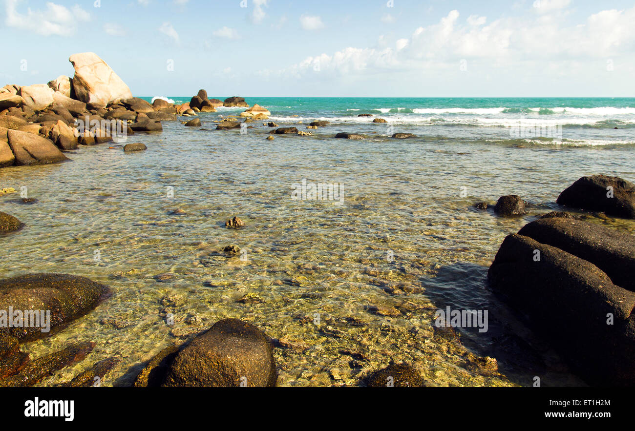 sea waves and coral beach with many rocks. summer holiday view Stock ...