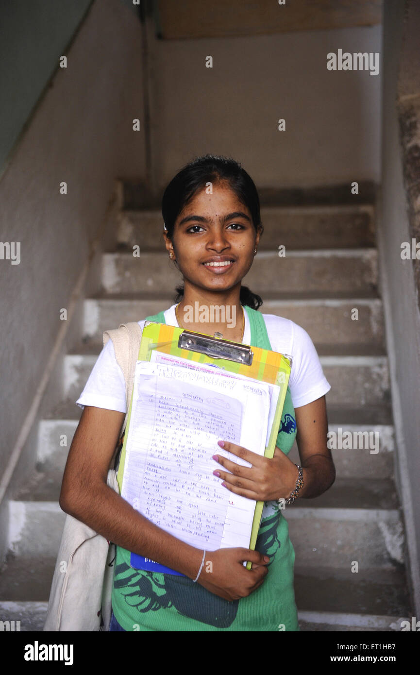 Teenage girl holding papers, India, Asia, MR#400 Stock Photo - Alamy