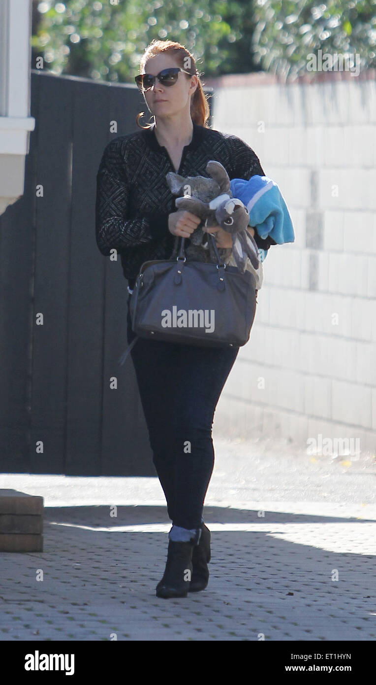 Amy Adams carries a plush rabbit while out running errands Featuring ...