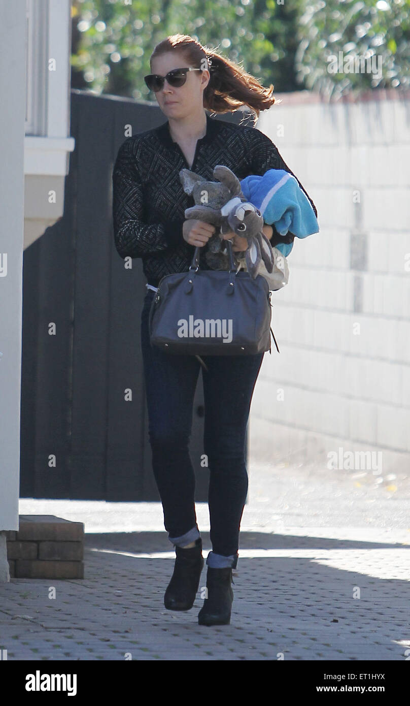 Amy Adams carries a plush rabbit while out running errands Featuring ...