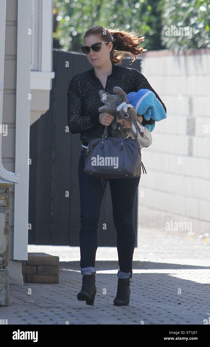 Amy Adams carries a plush rabbit while out running errands Featuring ...