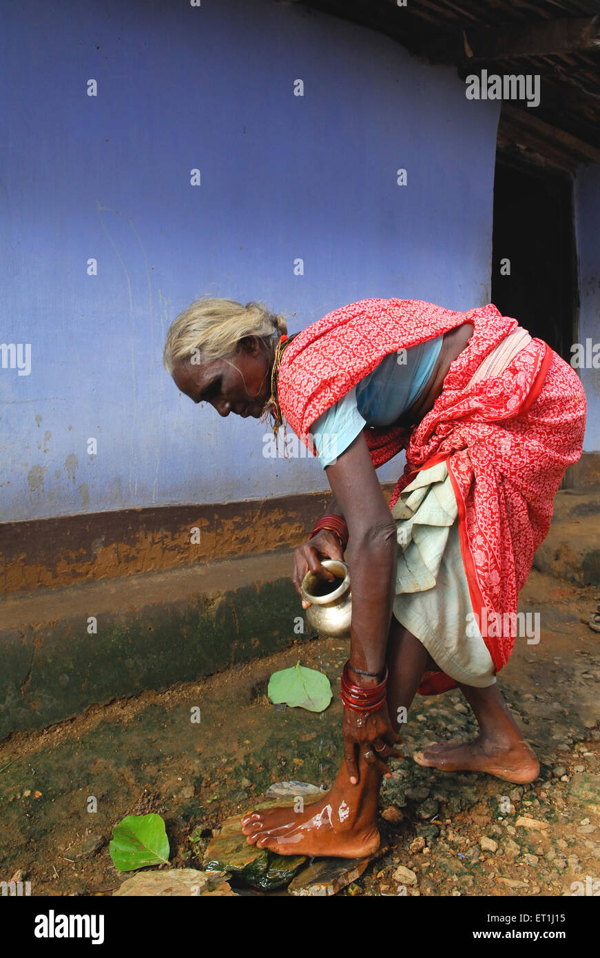 woman washing feet, Ho tribe, tribal people, Chakradharpur, West ...