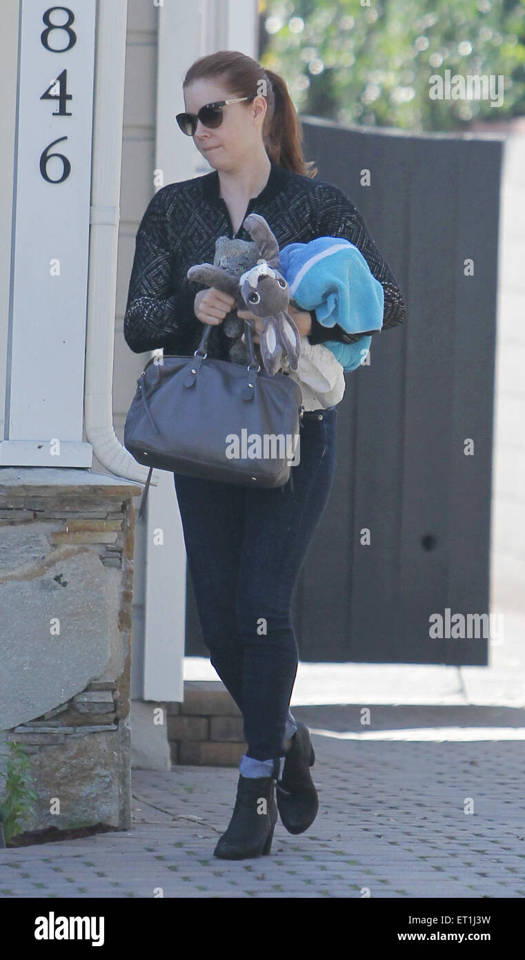 Amy Adams carries a plush rabbit while out running errands Featuring ...