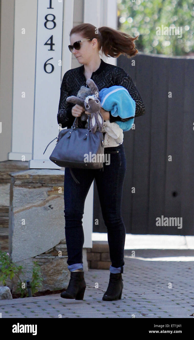 Amy Adams carries a plush rabbit while out running errands Featuring ...