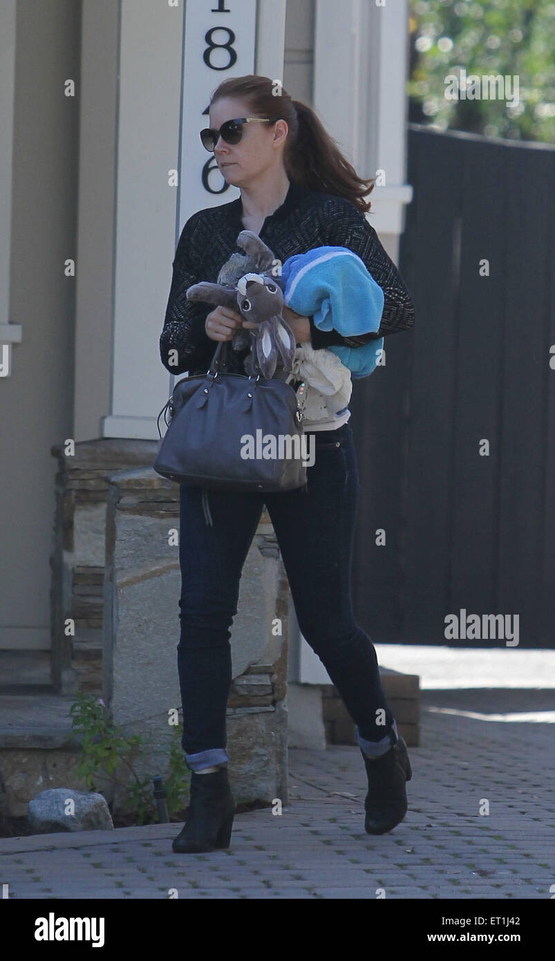 Amy Adams carries a plush rabbit while out running errands Featuring ...