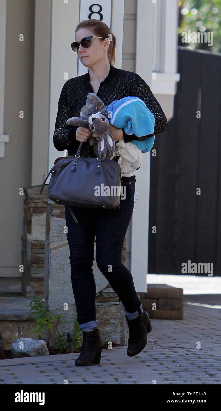 Amy Adams carries a plush rabbit while out running errands Featuring ...