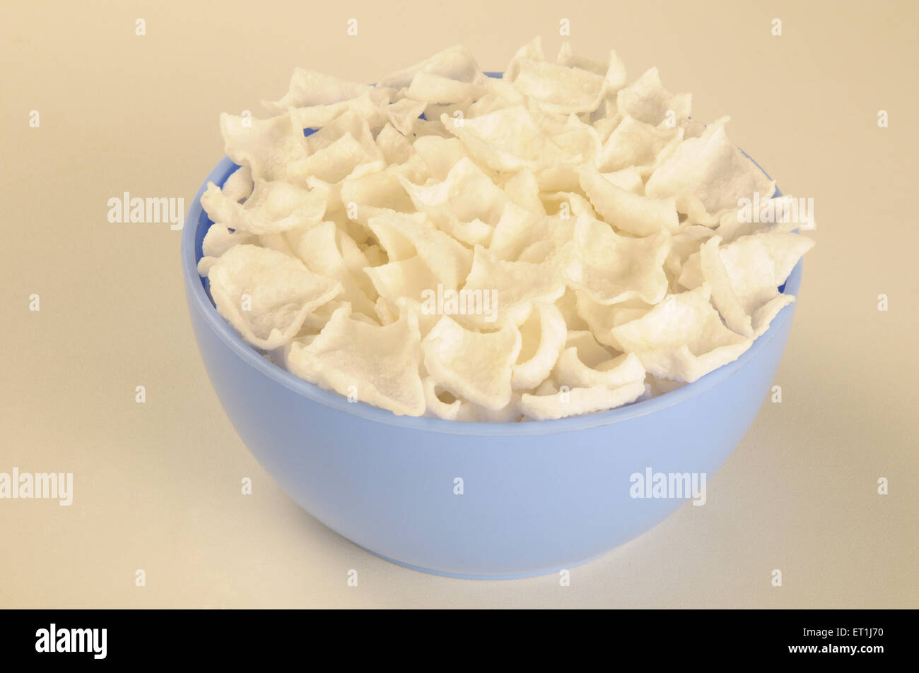 Snacks ; papad in blue bowl on white background 23 May 2008 Stock Photo ...