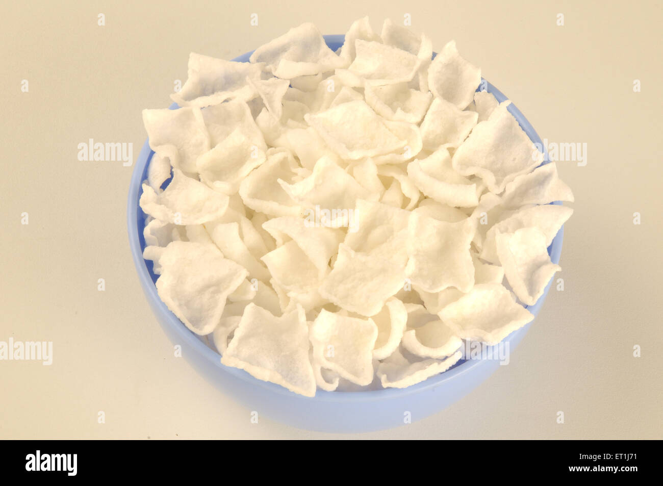 Snacks ; papad in blue bowl on white background 23 May 2008 Stock Photo ...