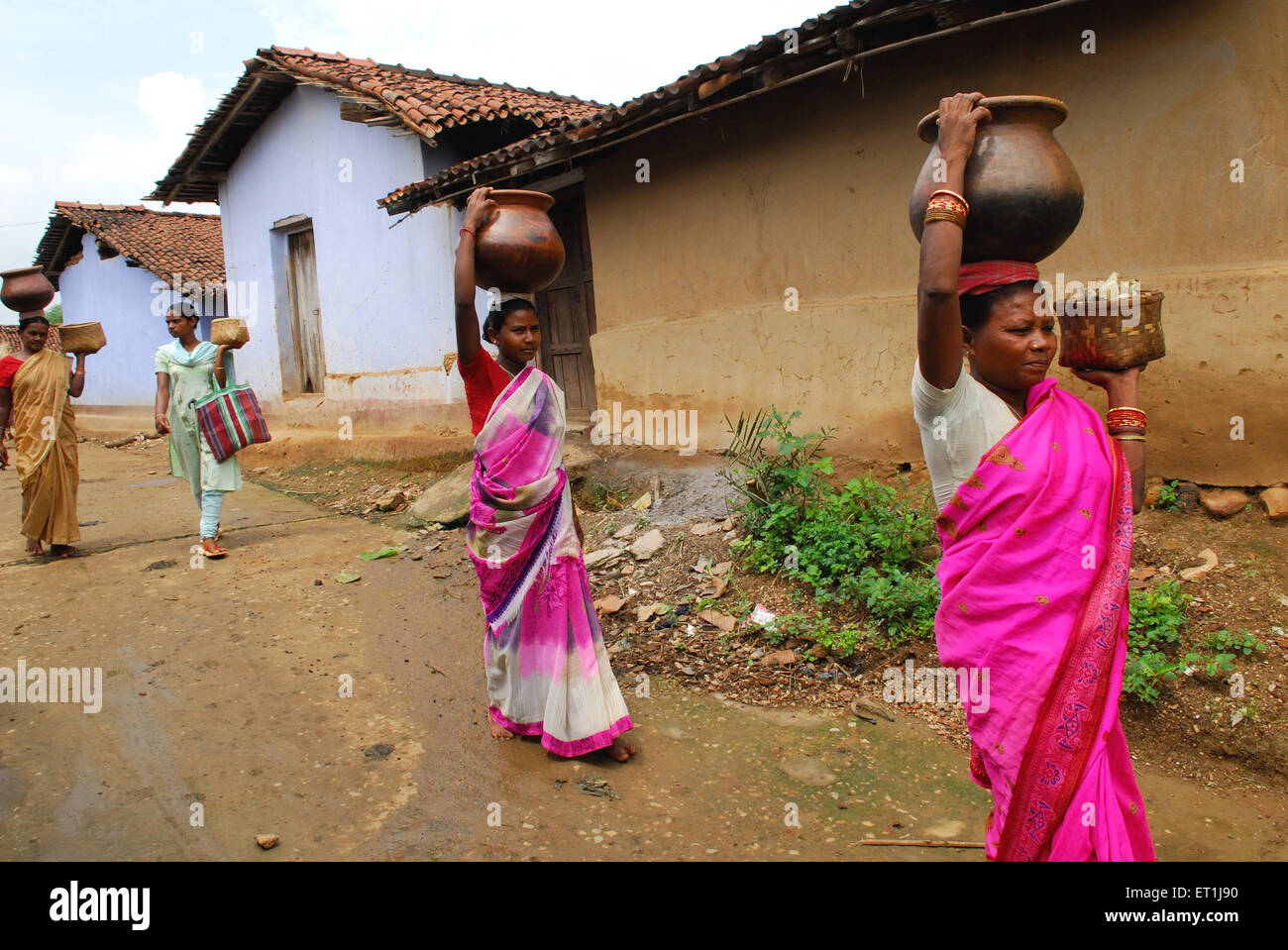 Women carrying pots, Ho tribe, tribal people, Chakradharpur, West ...