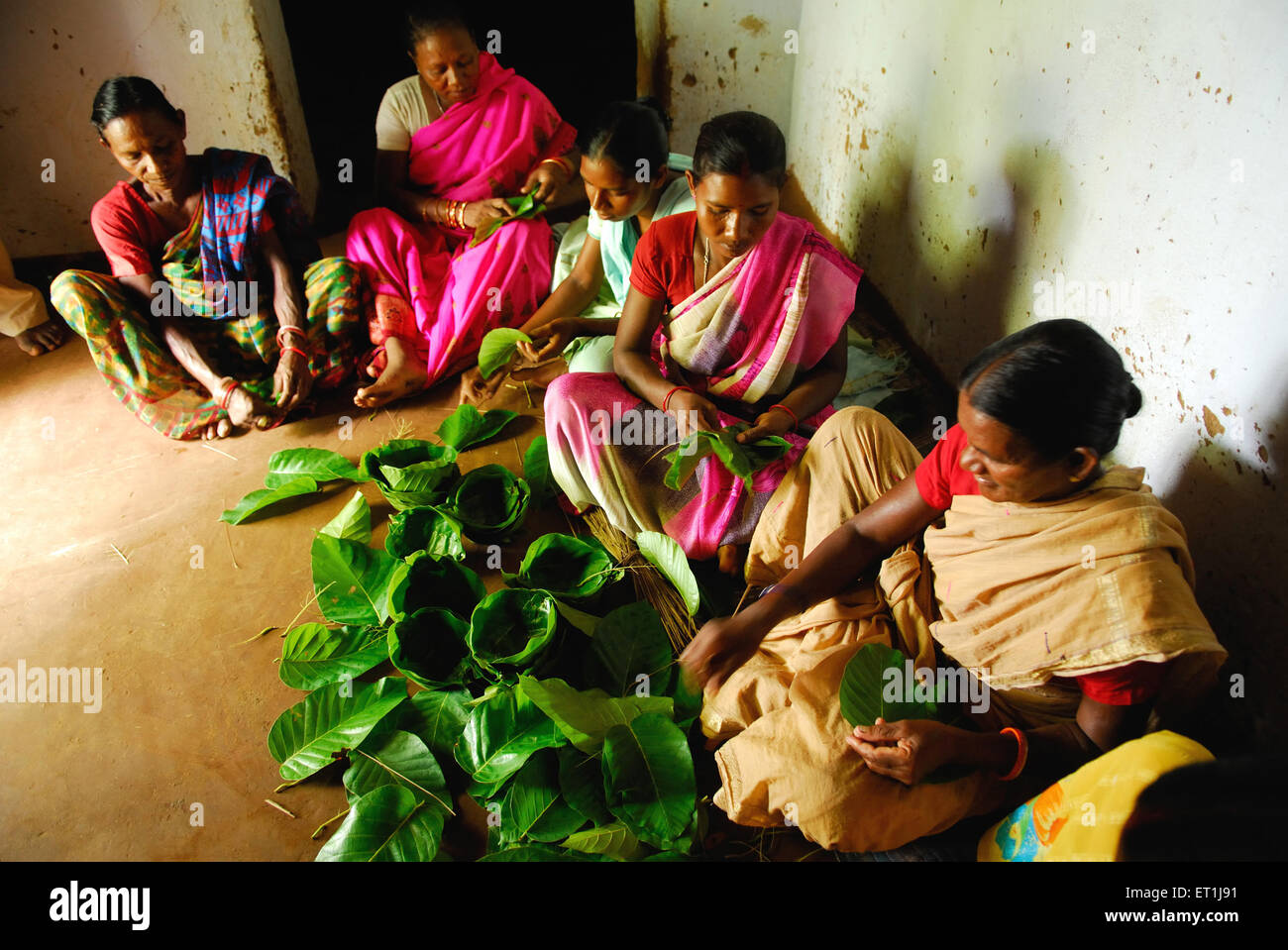 women making bowls with leaves, Ho tribe, tribal people, Chakradharpur ...