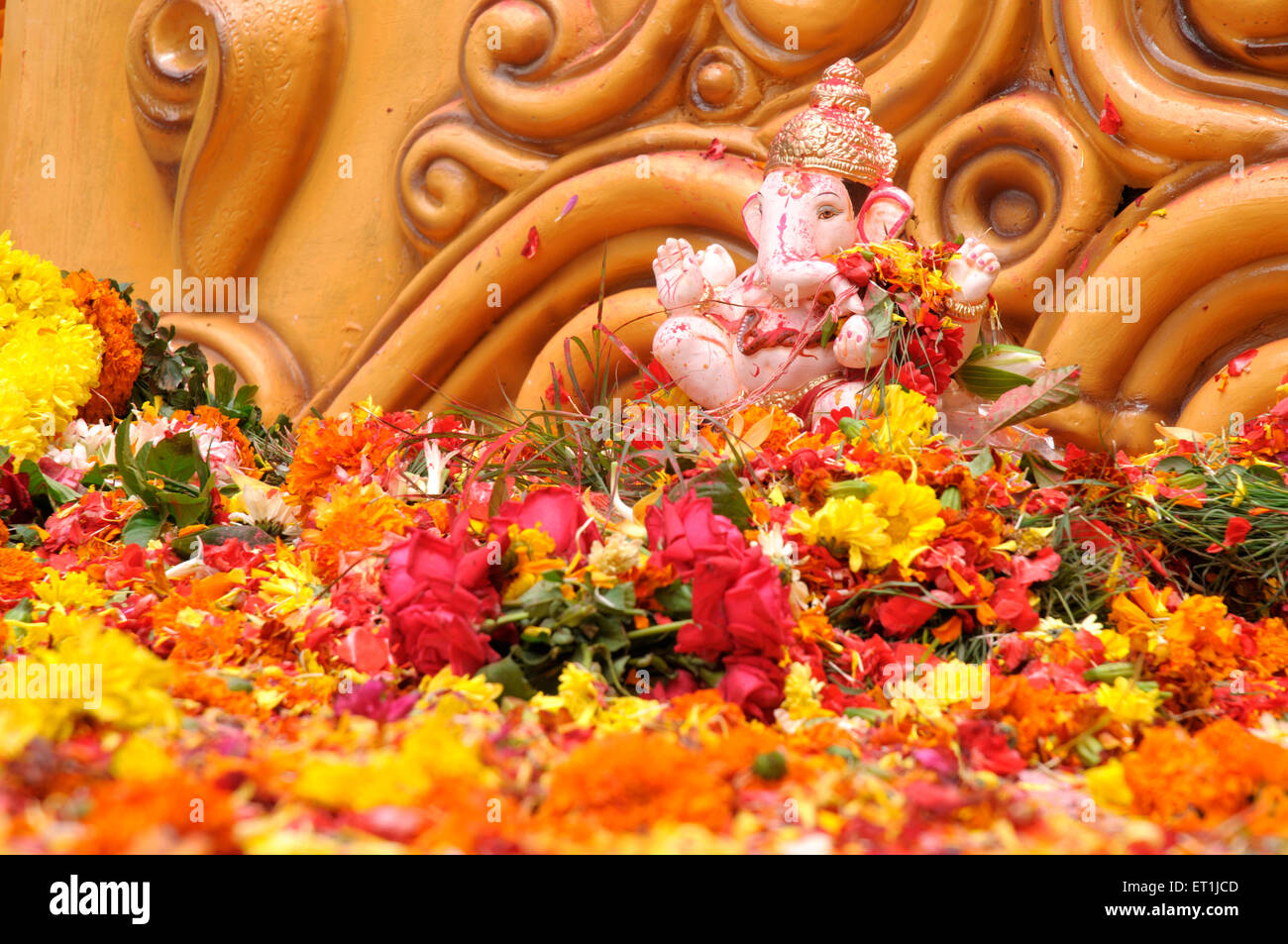 Lord ganesh with flowers ; Pune ; Maharashtra ; India 14 September 2008 ...