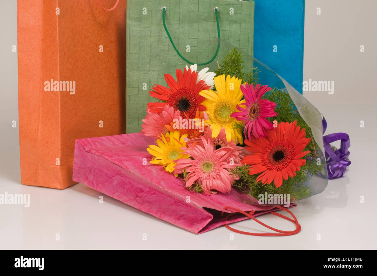 colorful paper shopping bags with colourful flowers Stock Photo - Alamy