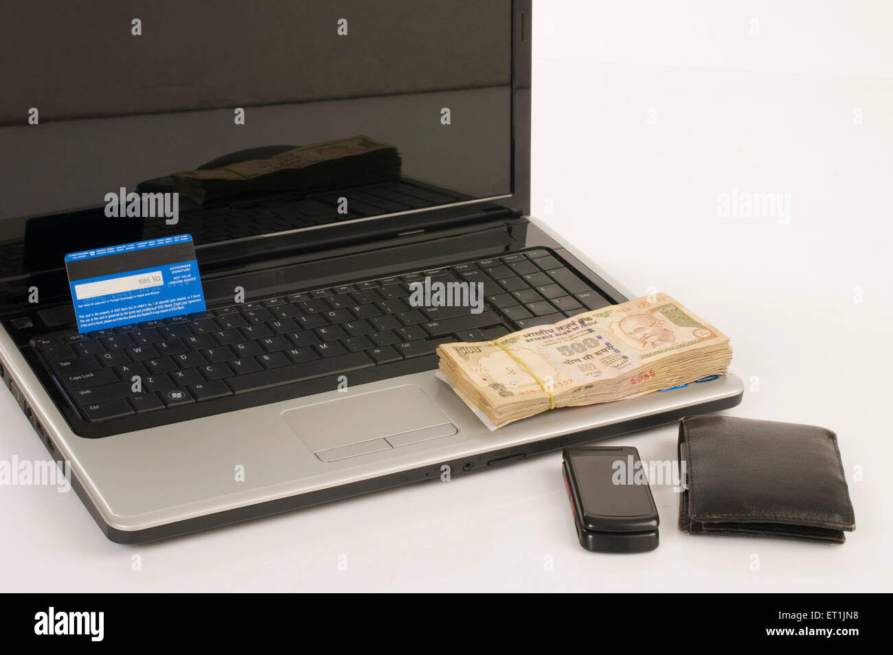Laptop with credit card and five hundred Rupee notes Pune Maharashtra ...