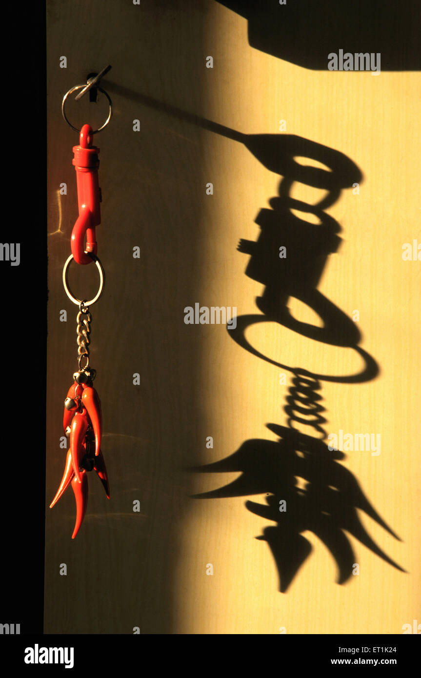 Red keychain shadow Stock Photo - Alamy