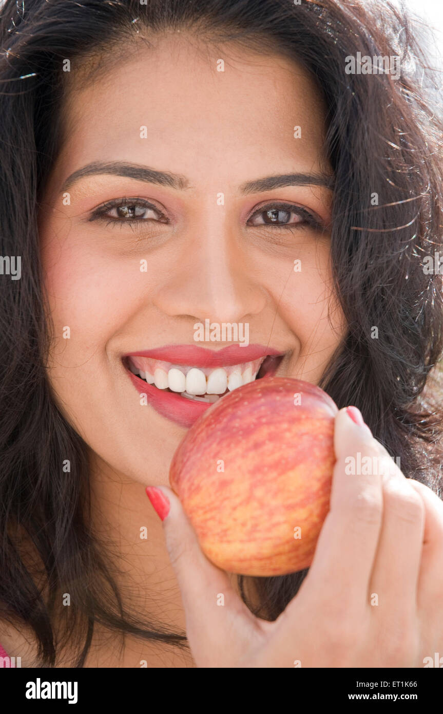 Apple in lady hand Pune Maharashtra India Asia Jan 2011 MR#686 W Stock ...