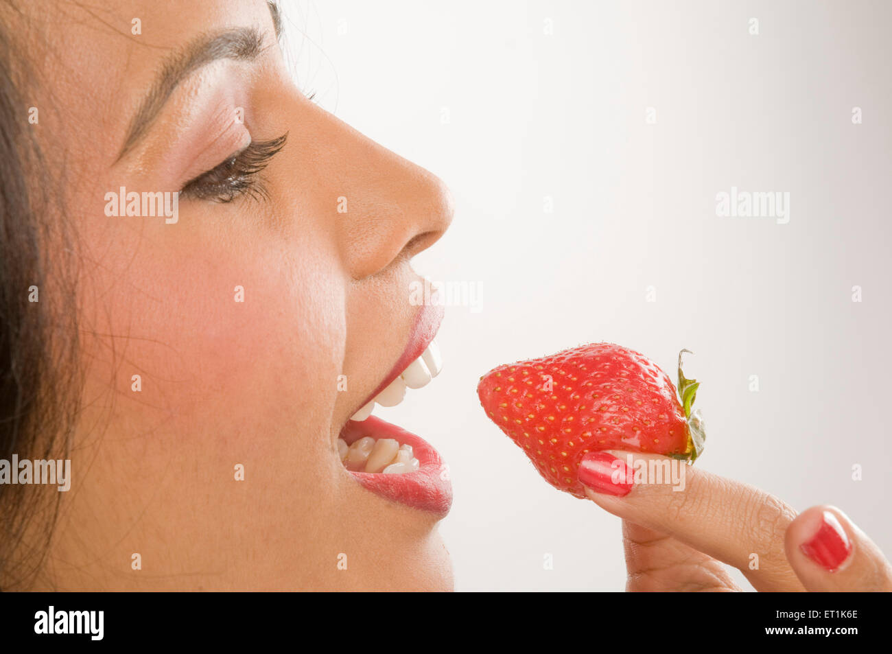 Lady with strawberry hi-res stock photography and images - Alamy