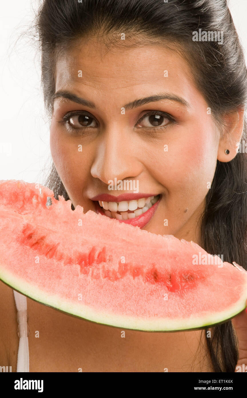 Lady eating Watermelon Pune Maharashtra India Asia Jan 2011 MR#686 W ...