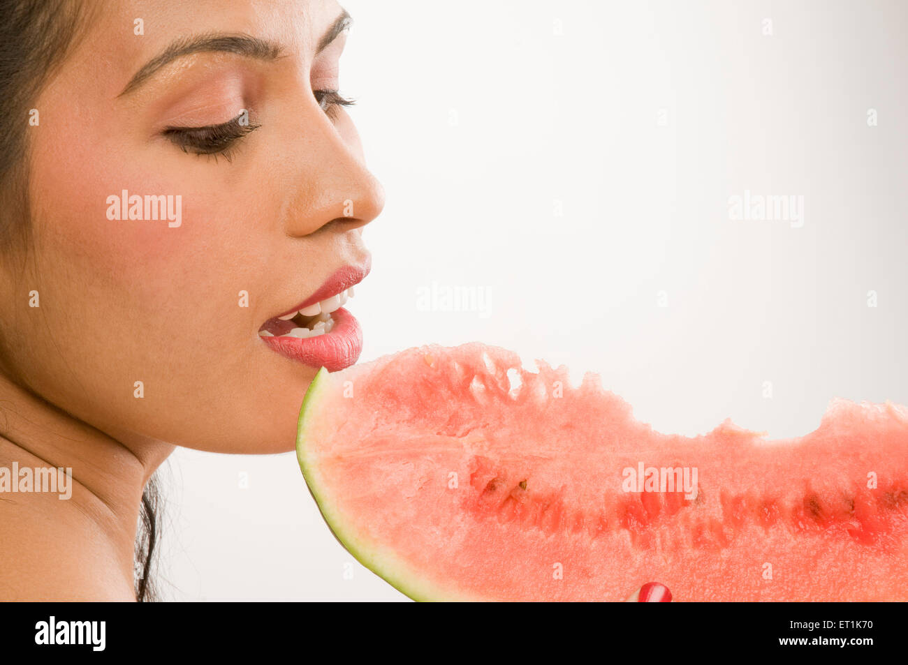 Lady eating Watermelon Pune Maharashtra India Asia Jan 2011 MR#686 W ...