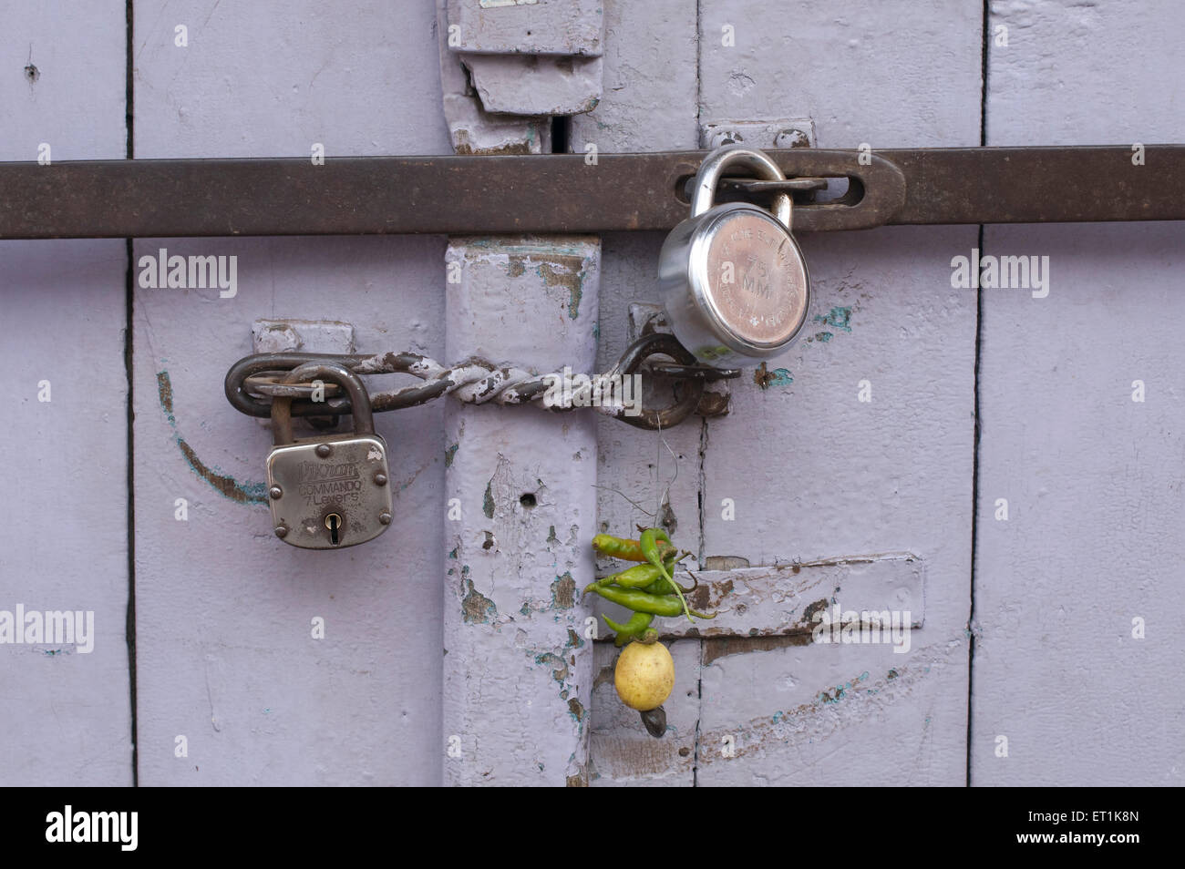Shop door locked with two locks Pune Maharashtra India Asia Sept 2011 ...