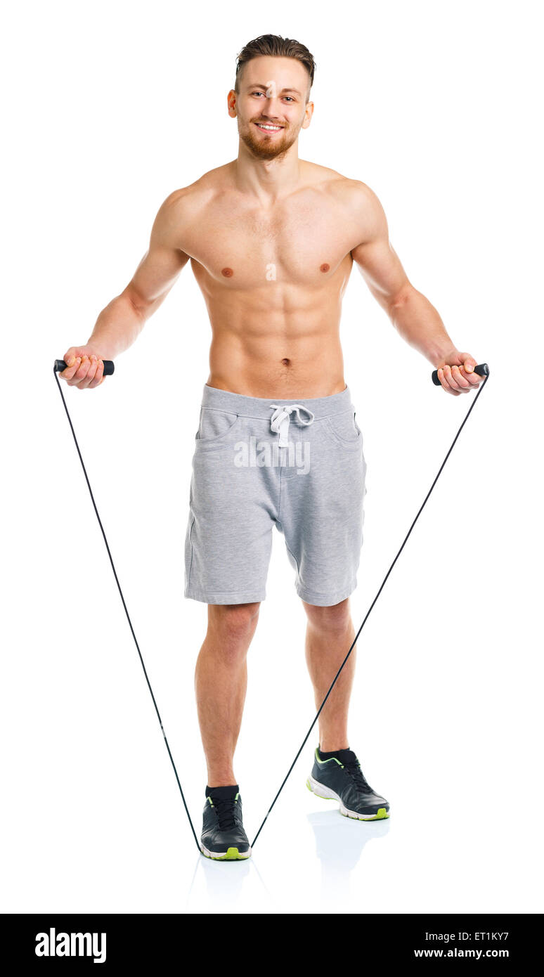 Athletic attractive man jumping on a rope on the white background Stock ...