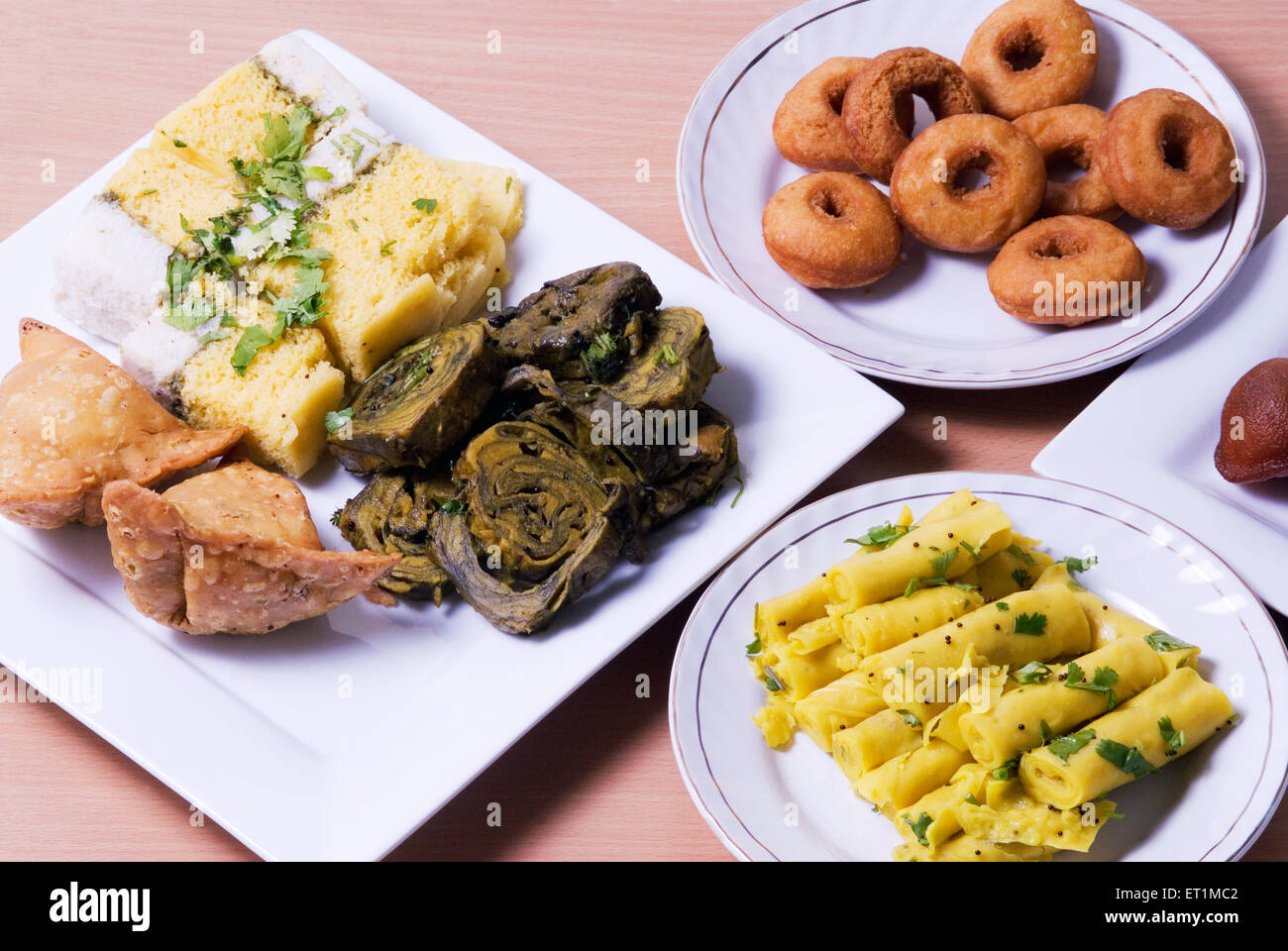 Indian spicy breakfast ; samosa ; dhokla ; idle ; suralichya vadya ...