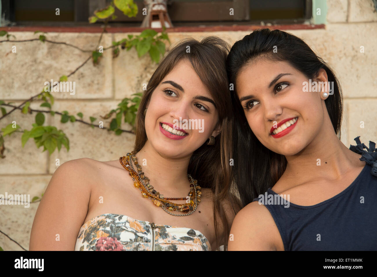 Portrait of two young Latin woman Stock Photo - Alamy