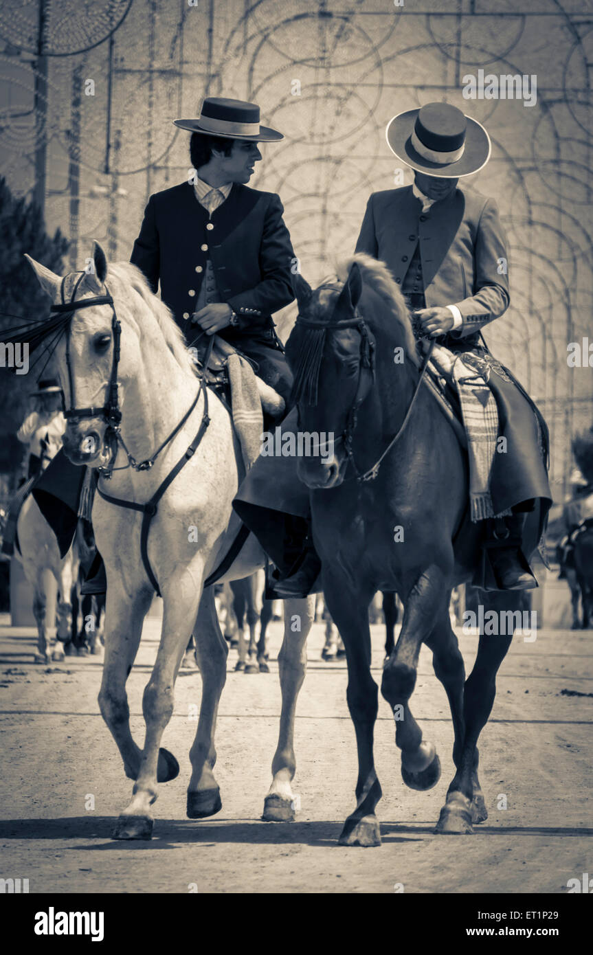 Spanish horse riders in traditional clothing Stock Photo - Alamy